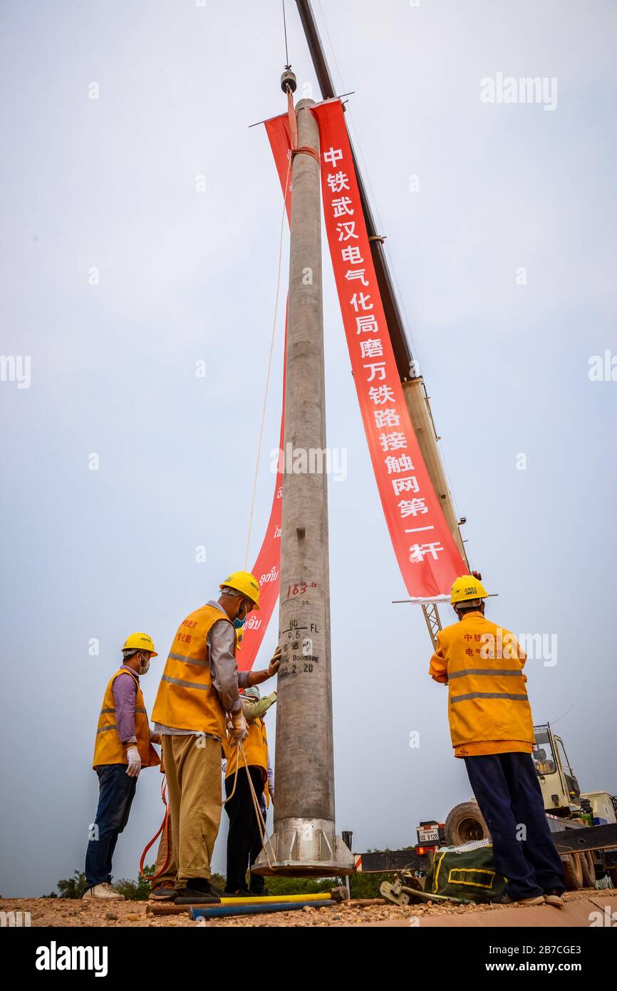 Vientiane, Laos. 15th Mar, 2020. Workers plant the first engineering ...