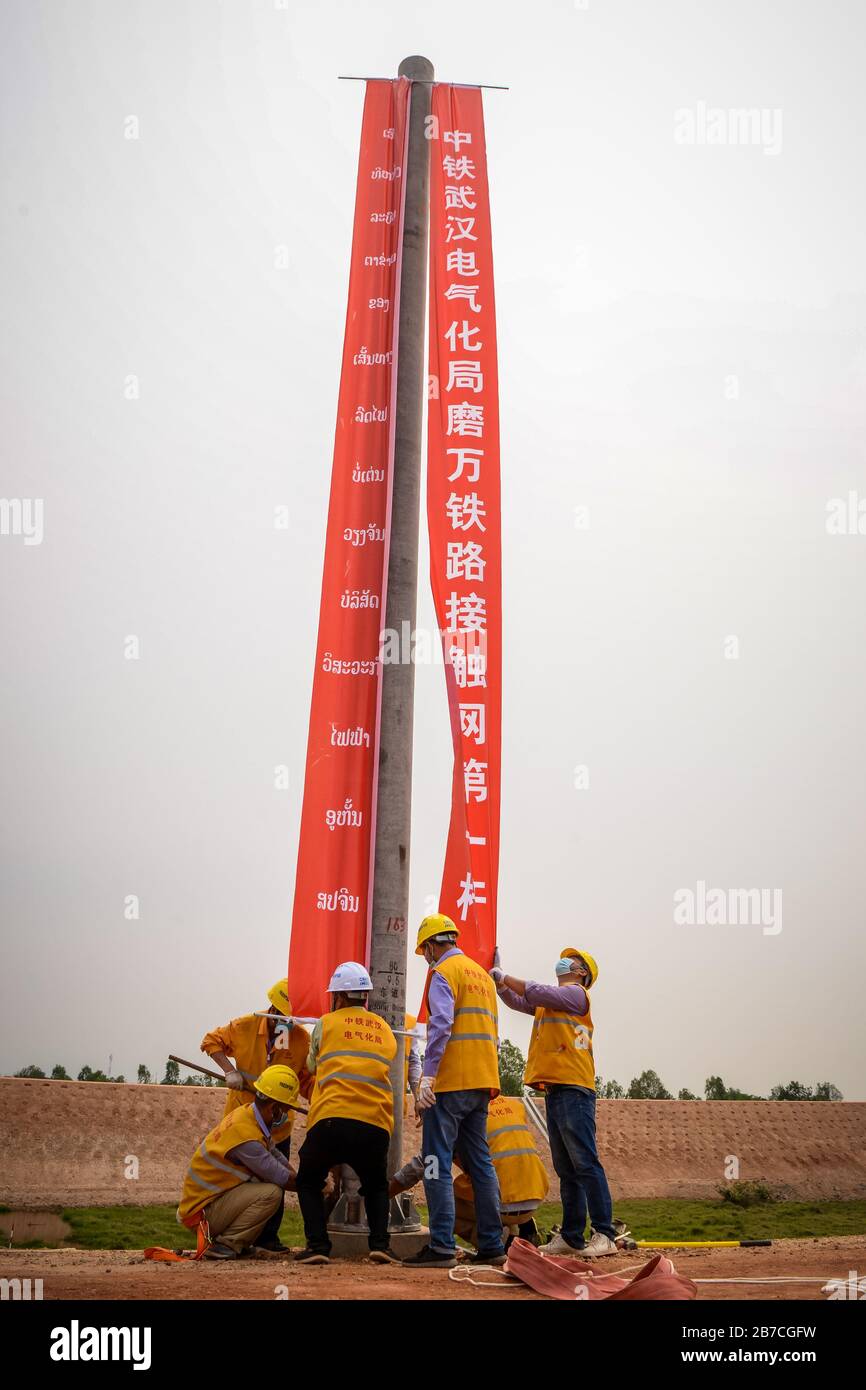 Vientiane, Laos. 15th Mar, 2020. Workers plant the first engineering ...