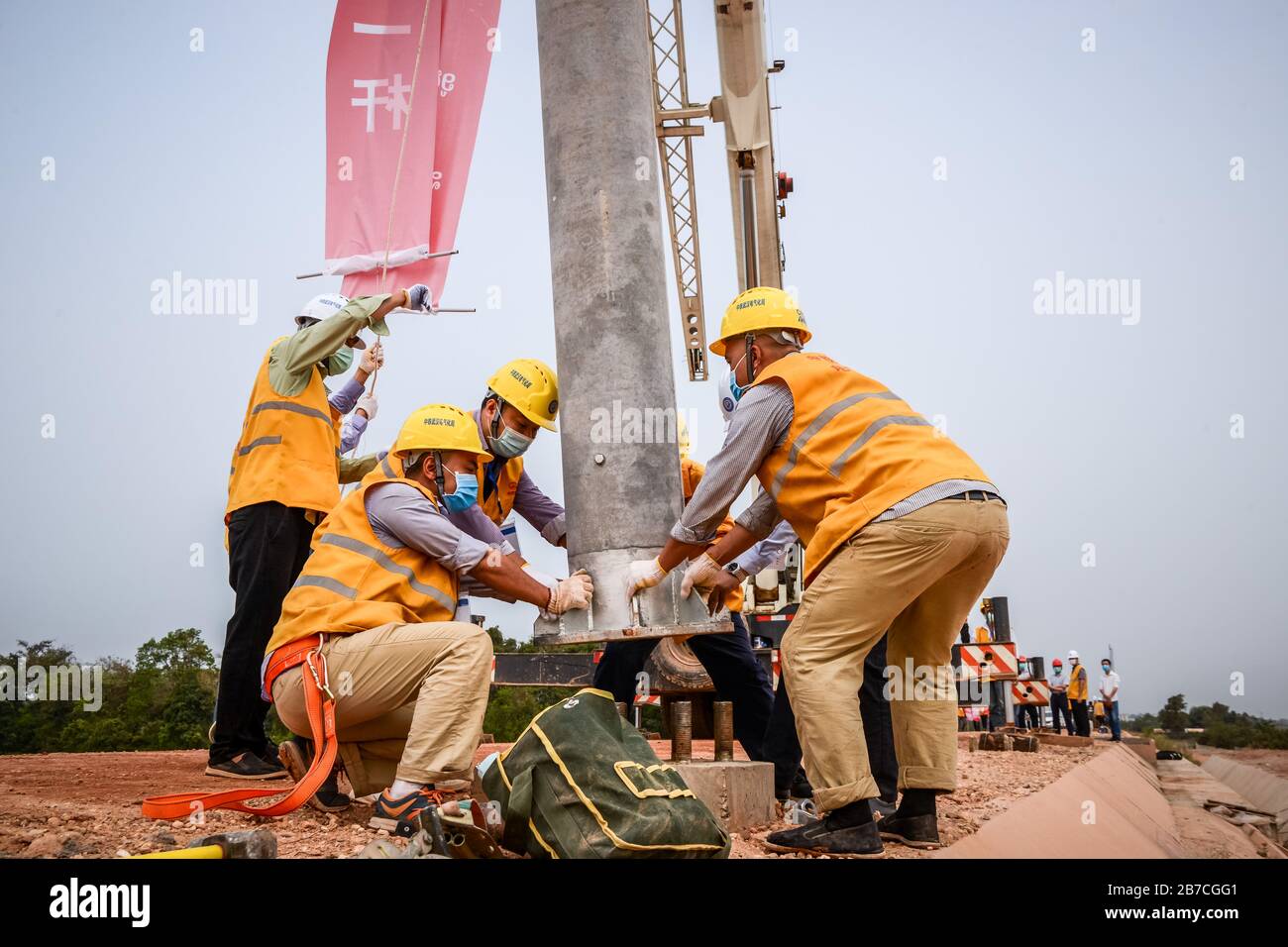 Vientiane, Laos. 15th Mar, 2020. Workers plant the first engineering ...