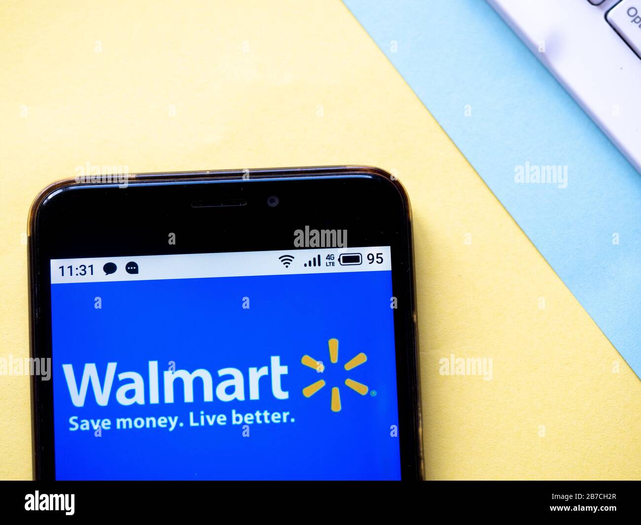 In this photo illustration the Walmart logo is seen displayed on a ...