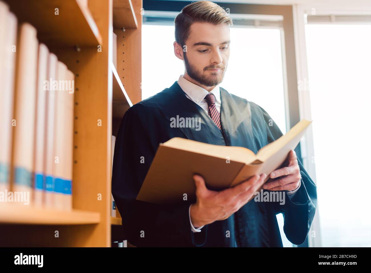 Lawyer with robe ready for court reading after the law one last time ...