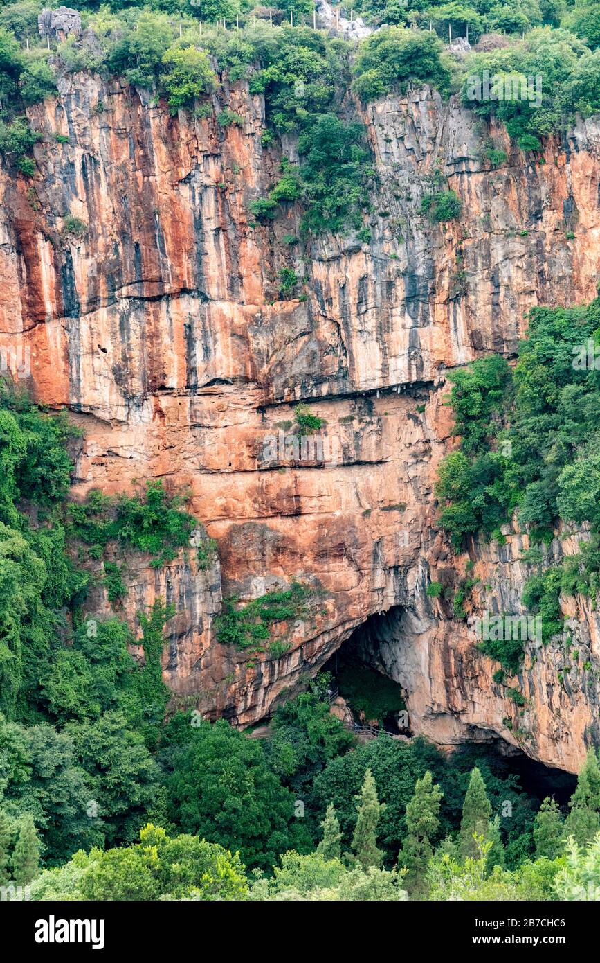Aerial view of Jiuxiang Gorge and Caves National Geopark cave entrance ...