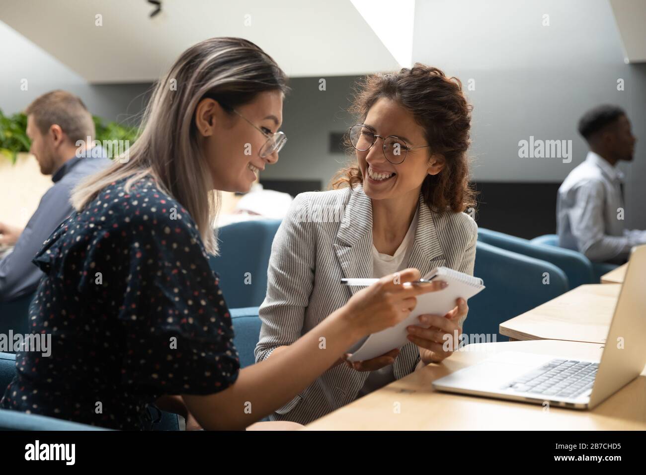 Happy diverse colleagues having fun, working on project together Stock ...