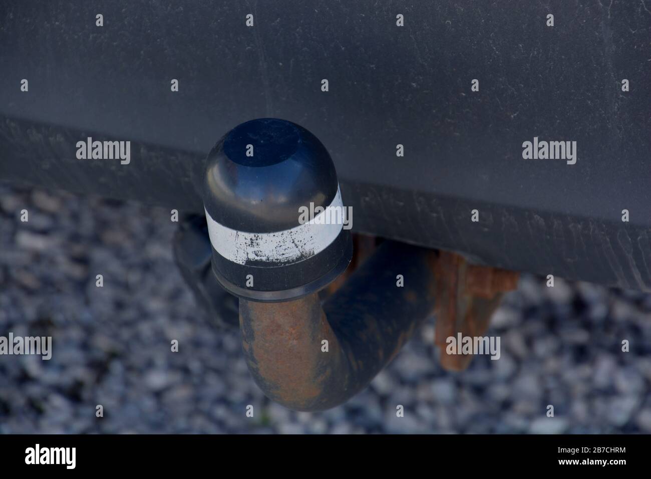 trailer coupling on a car with cap closeup, rusty coupling on a car ...