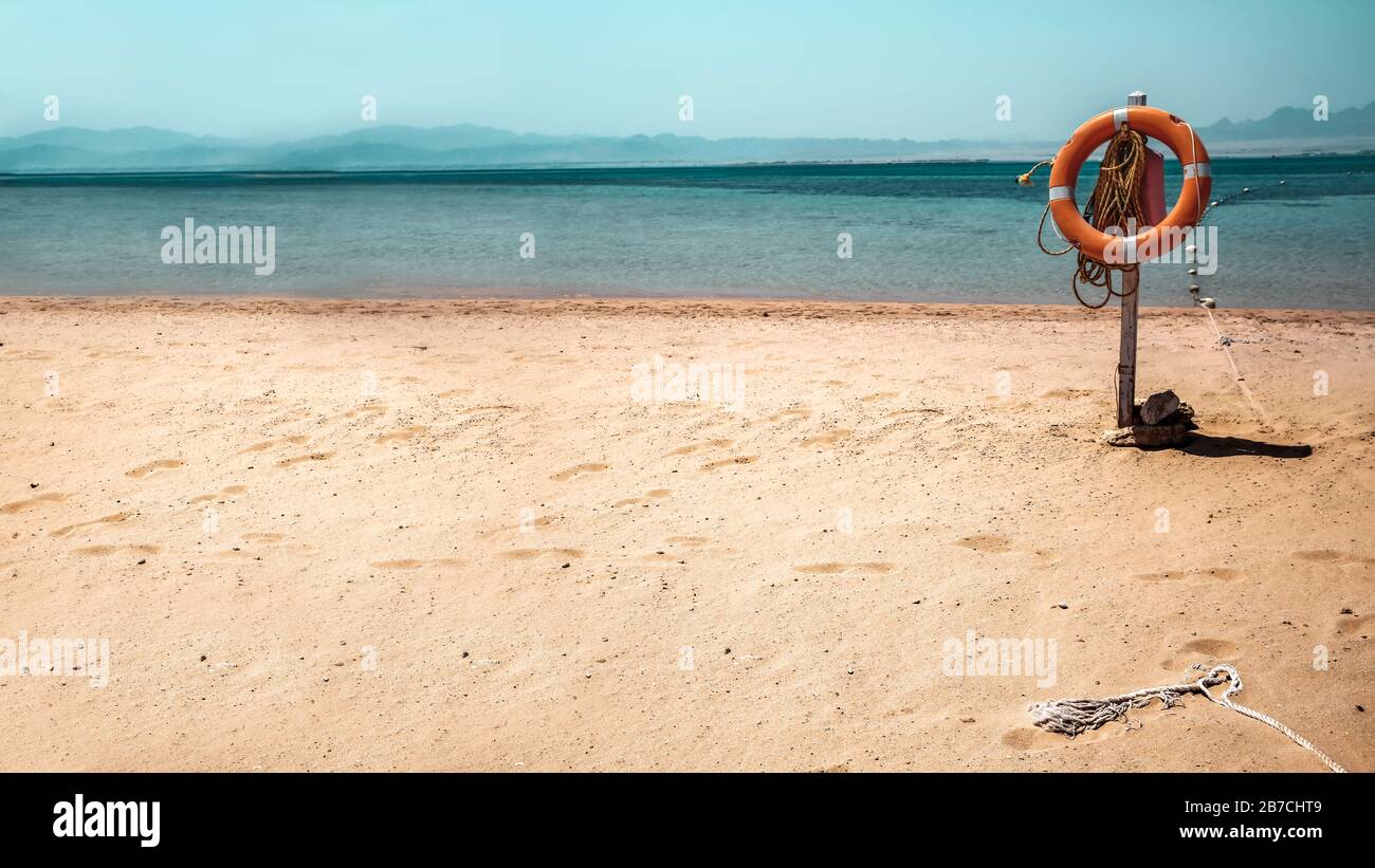 Sunny sandy beach in summer time with sea and blue sky background Stock ...