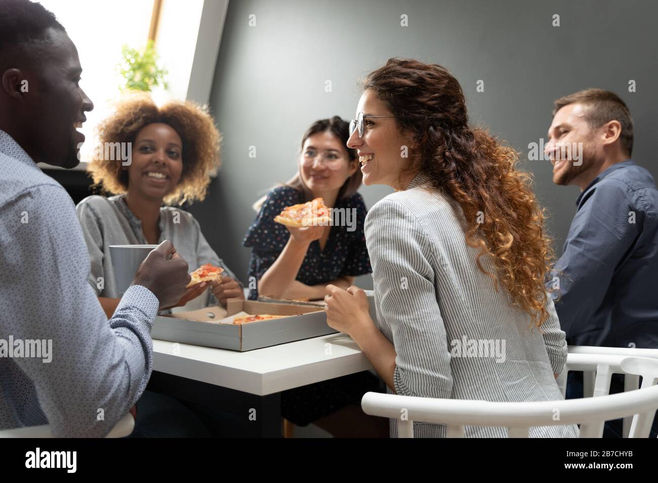 Diverse group people enjoying meal hi-res stock photography and images ...