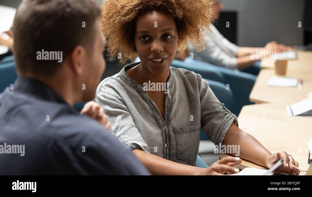 Confident African American businesswoman consulting client about deal ...