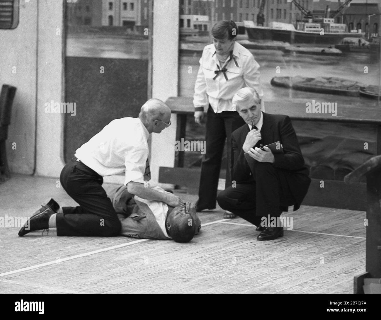 1980s, historical, First aid practice indoors, an adult man being ...
