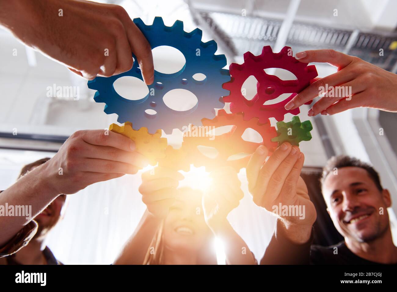 Business team connect pieces of gears. Teamwork, partnership and ...