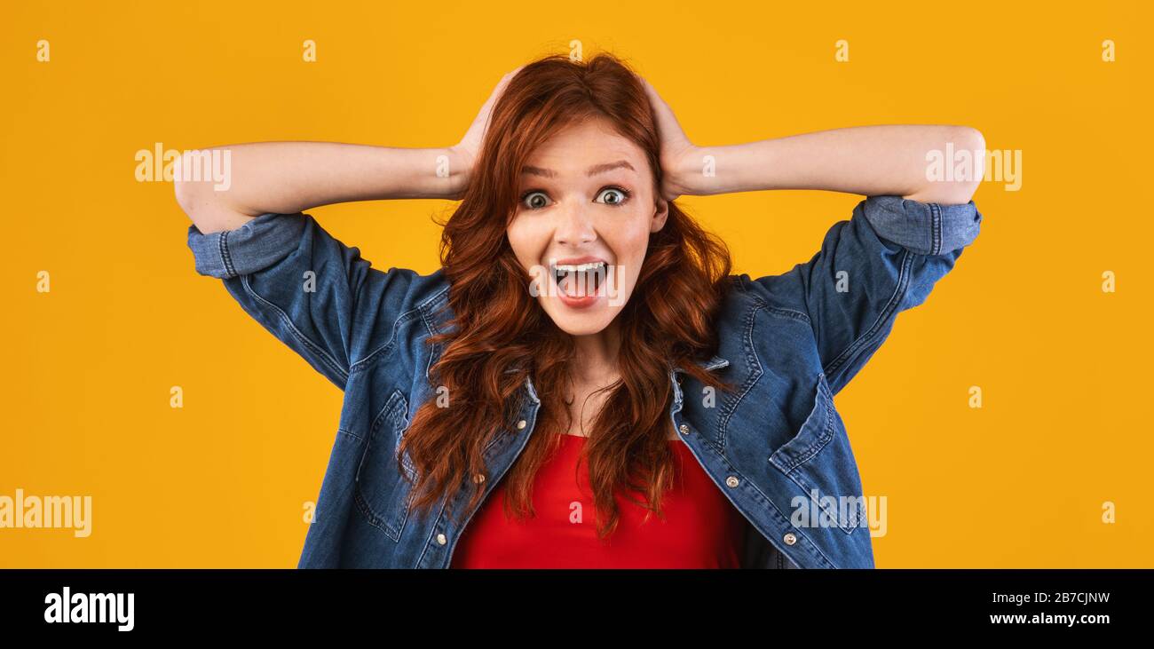 Excited Girl Shouting Touching Head Posing Over Yellow Background ...