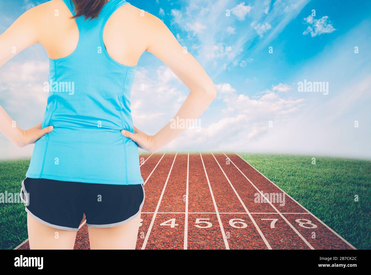 Back young asian woman start a run with track and nature background ...
