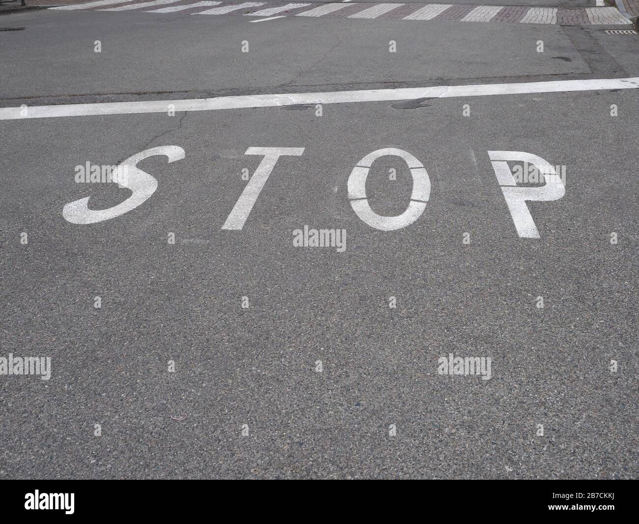 Warning signs, stop traffic sign on tarmac Stock Photo - Alamy