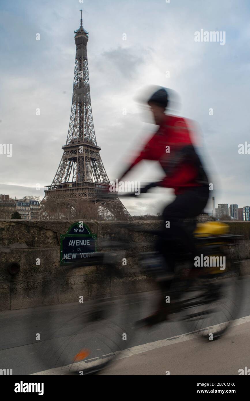 Cycling past the eiffel tower hi-res stock photography and images - Alamy