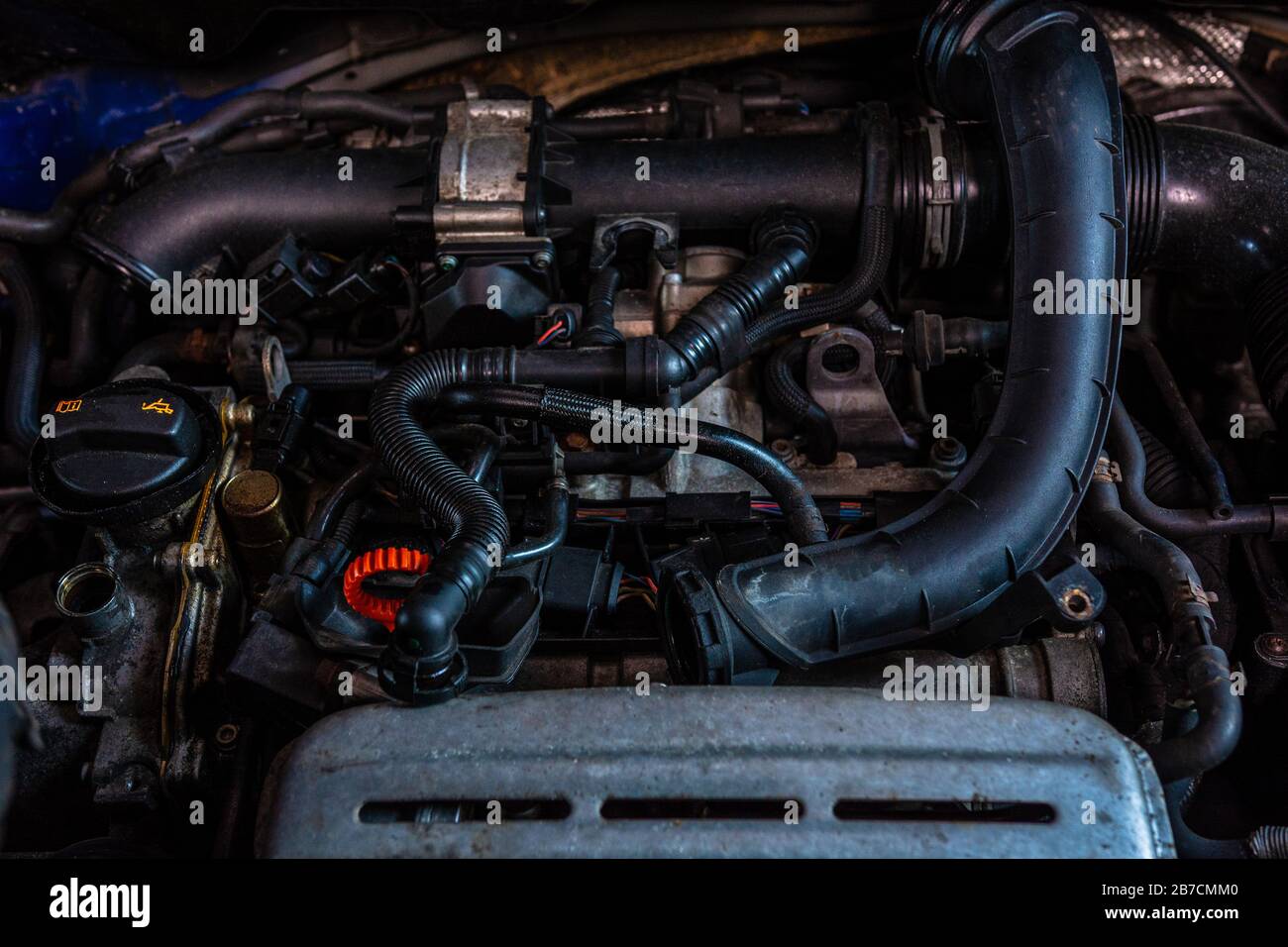 closeup of car turbo engine with oil filler neck for lubrication of ...