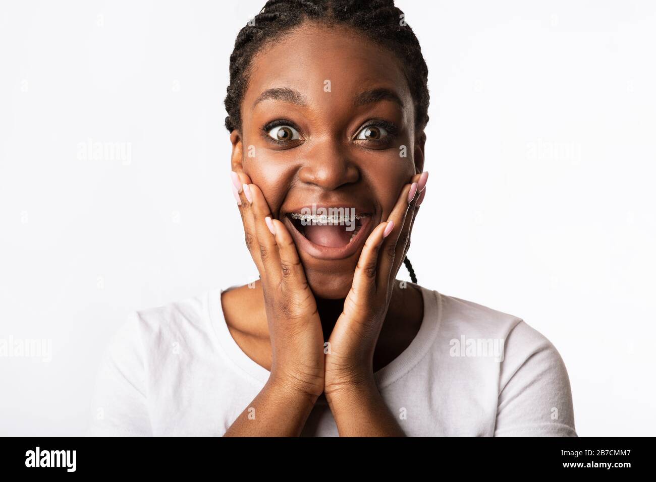Excited Girl With Braces Shouting In Excitement On White Background ...