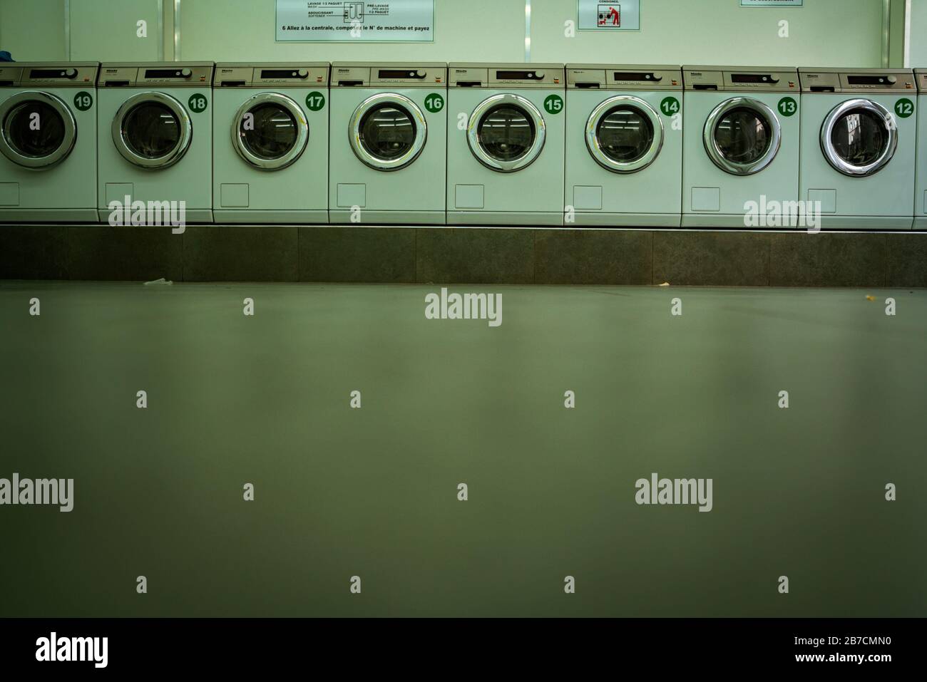 Washing Machines in Paris launderette Stock Photo - Alamy