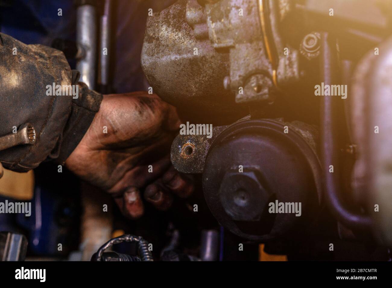 Car mechanic servicing car engine in car service closeup 2020 Stock ...