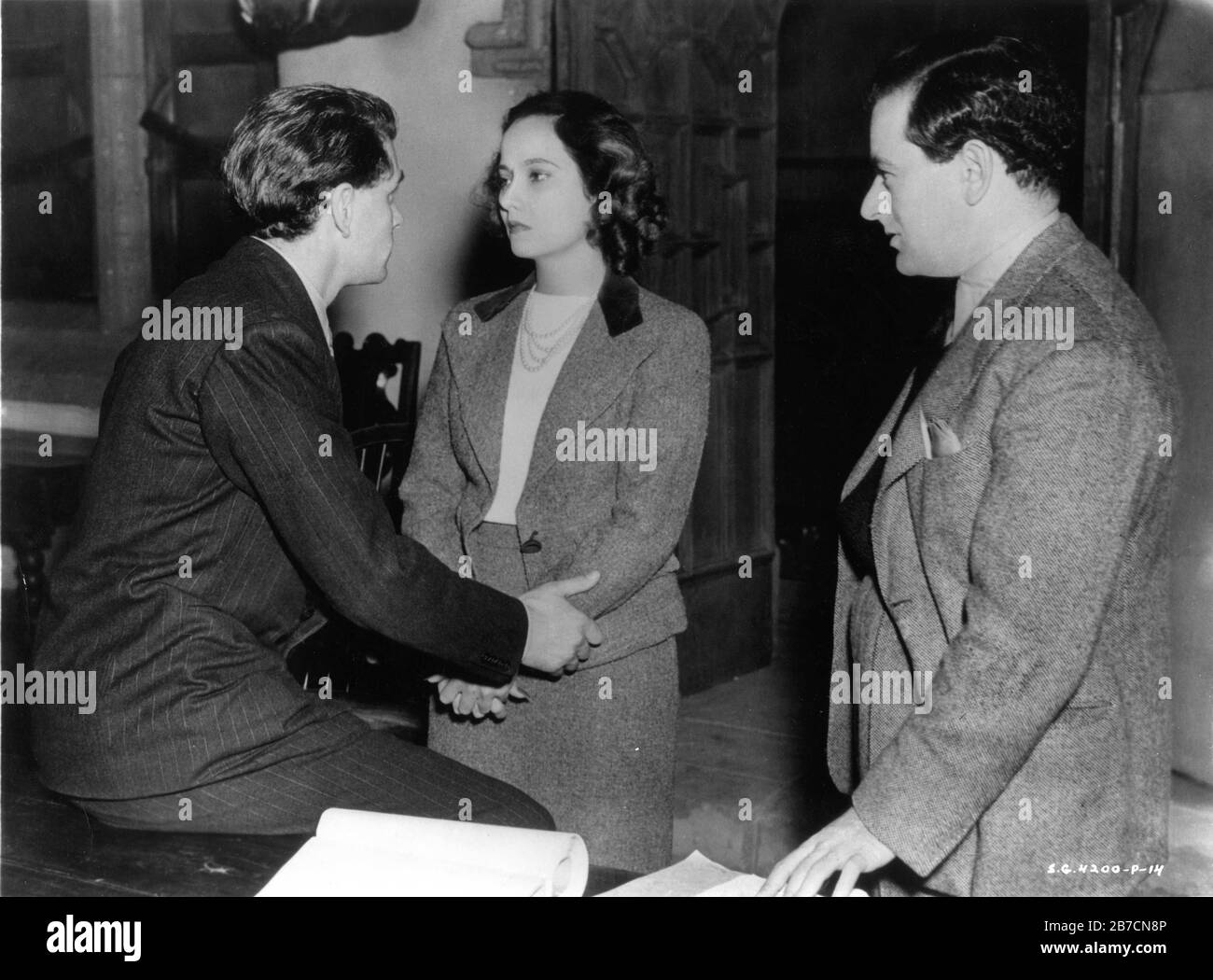 LAURENCE OLIVIER and MERLE OBERON rehearsing with Director WILLIAM WYLER on set candid during ...