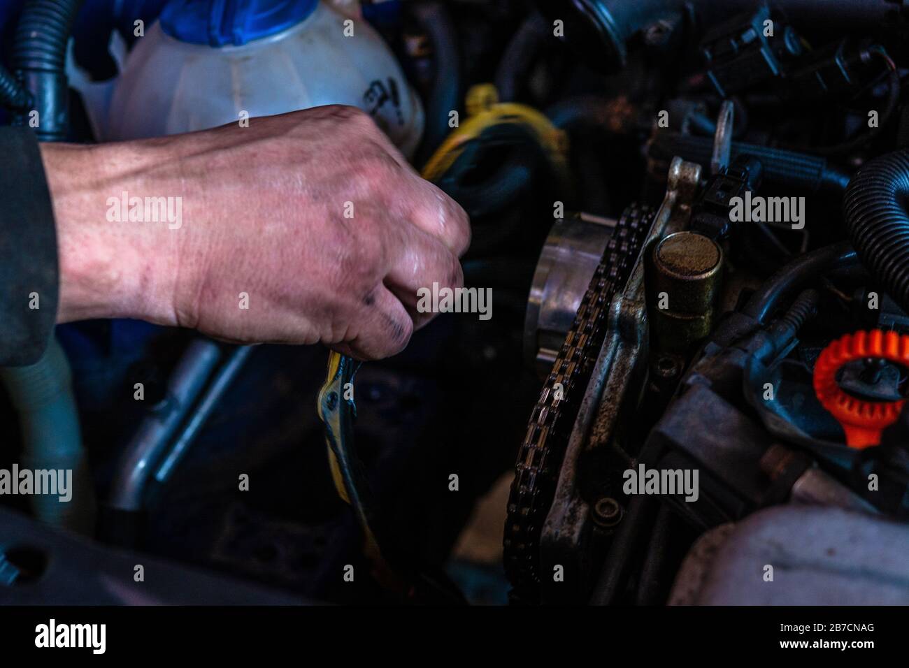 Car mechanic servicing car engine in car service closeup 2020 Stock ...