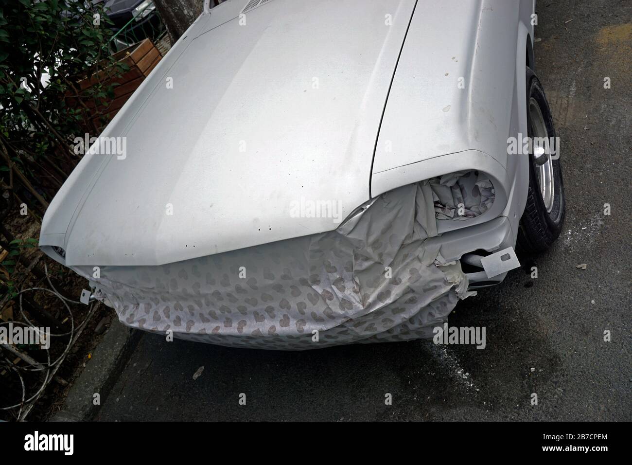 Classic vintage wrecked junk cars in the street Stock Photo - Alamy