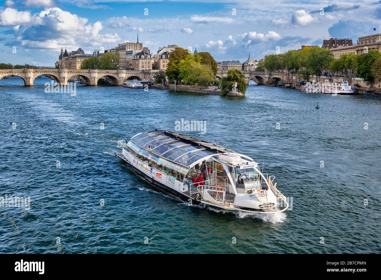 Bateau-mouche traditional parisian tour boat navigating the river Seine ...
