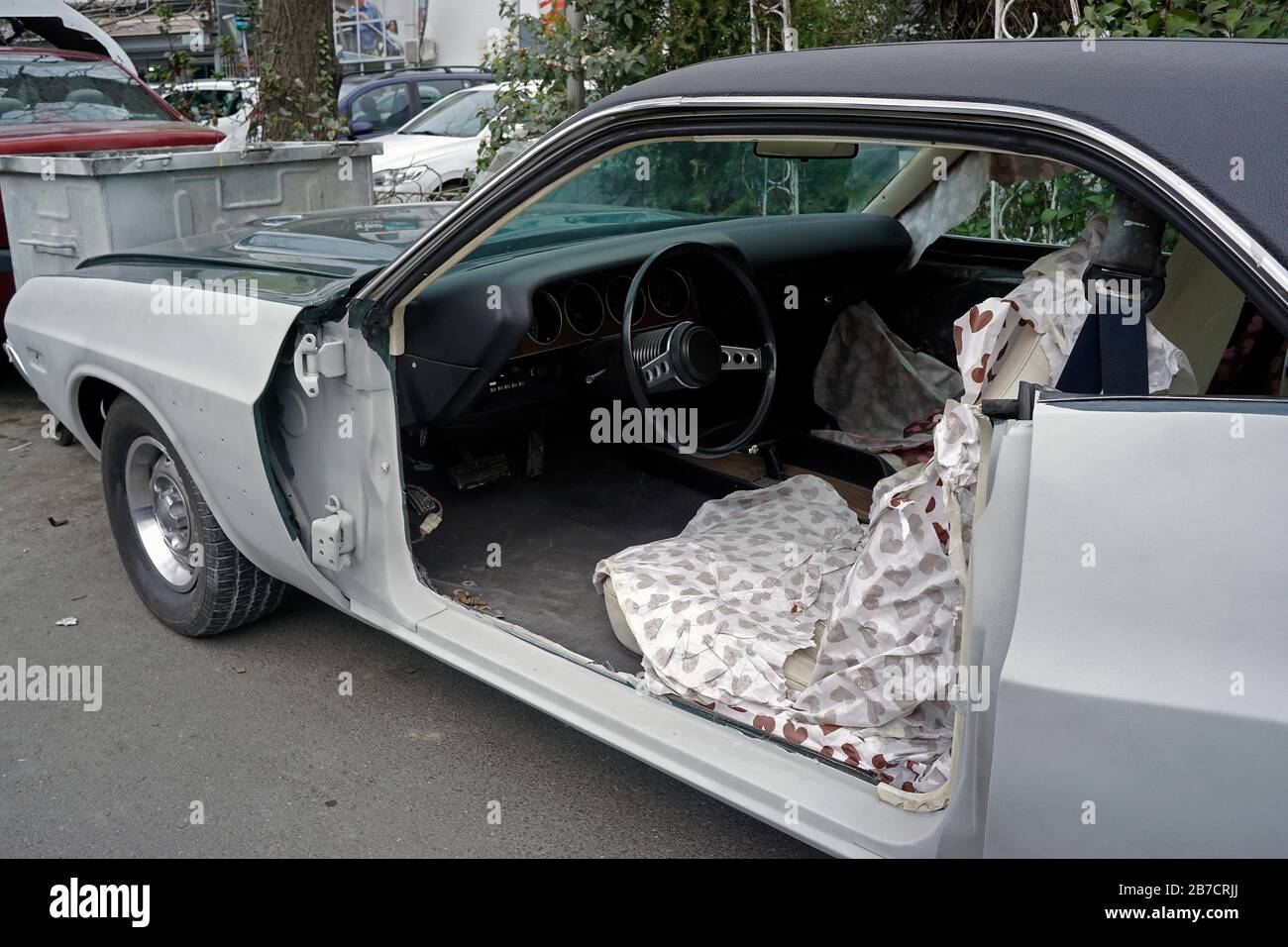 Classic vintage wrecked junk cars in the street Stock Photo - Alamy