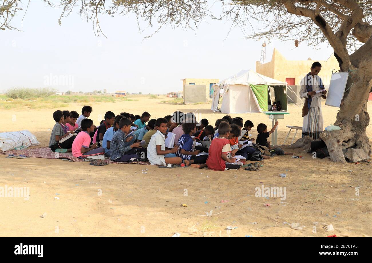 School under a tree hi-res stock photography and images - Alamy