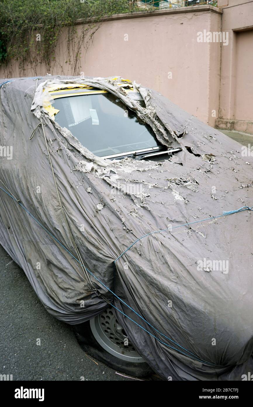 Classic vintage wrecked junk cars in the street Stock Photo - Alamy