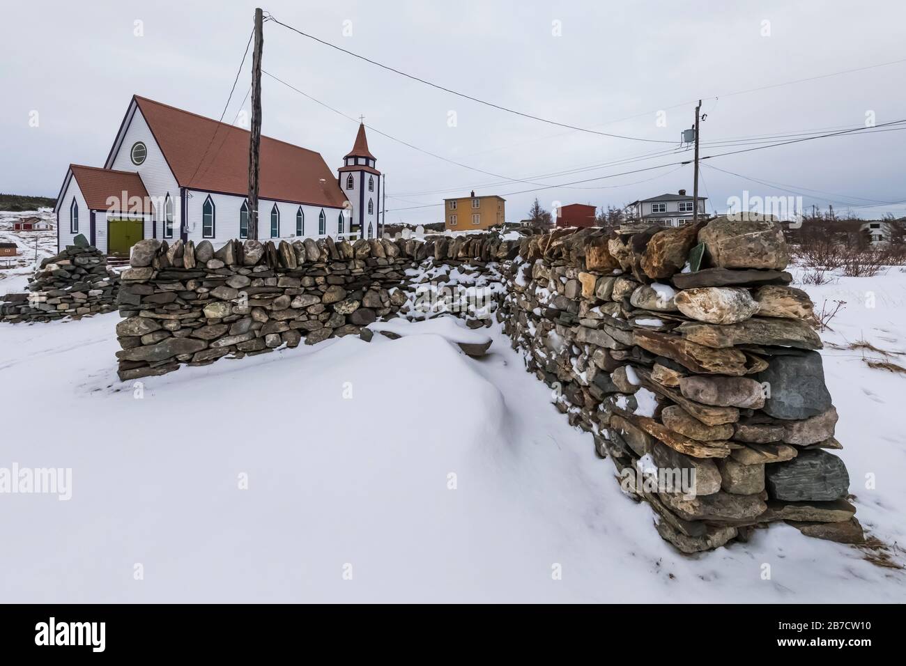 All Saints Anglican Church behind a dry stone wall art installation in ...