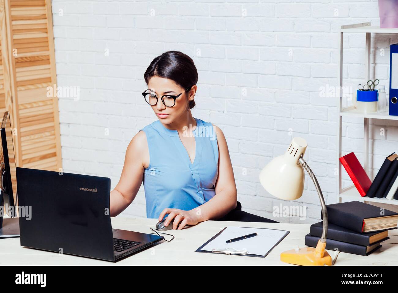 girl in the workplace at the computer in the Office Stock Photo - Alamy