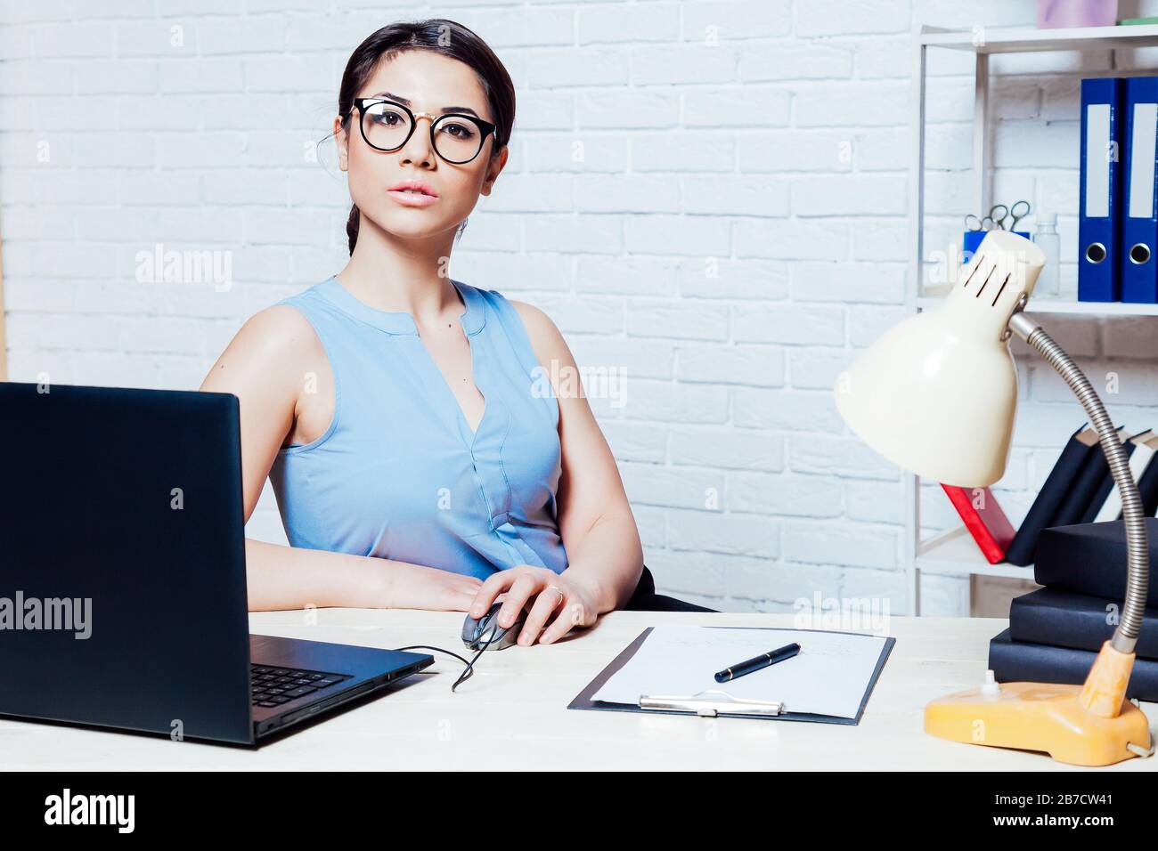 girl in the workplace at the computer in the Office Stock Photo - Alamy