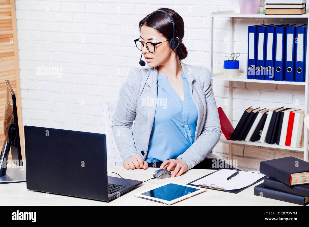 the girl works in an Office at a computer Stock Photo - Alamy
