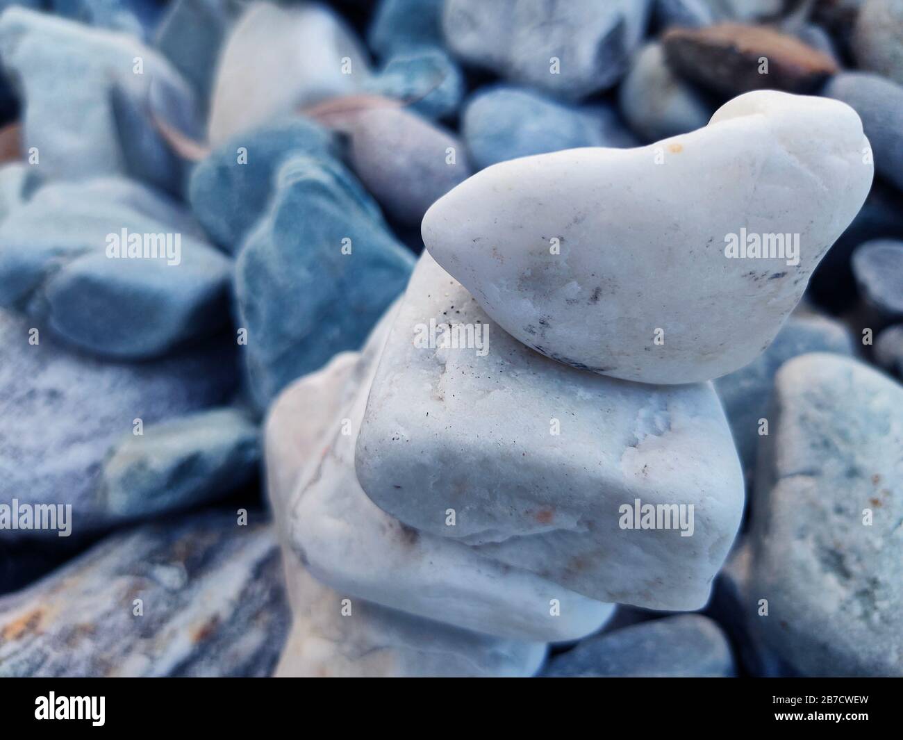 Stack of triangular stones.Group of white and colorful Stones.Pebble ...