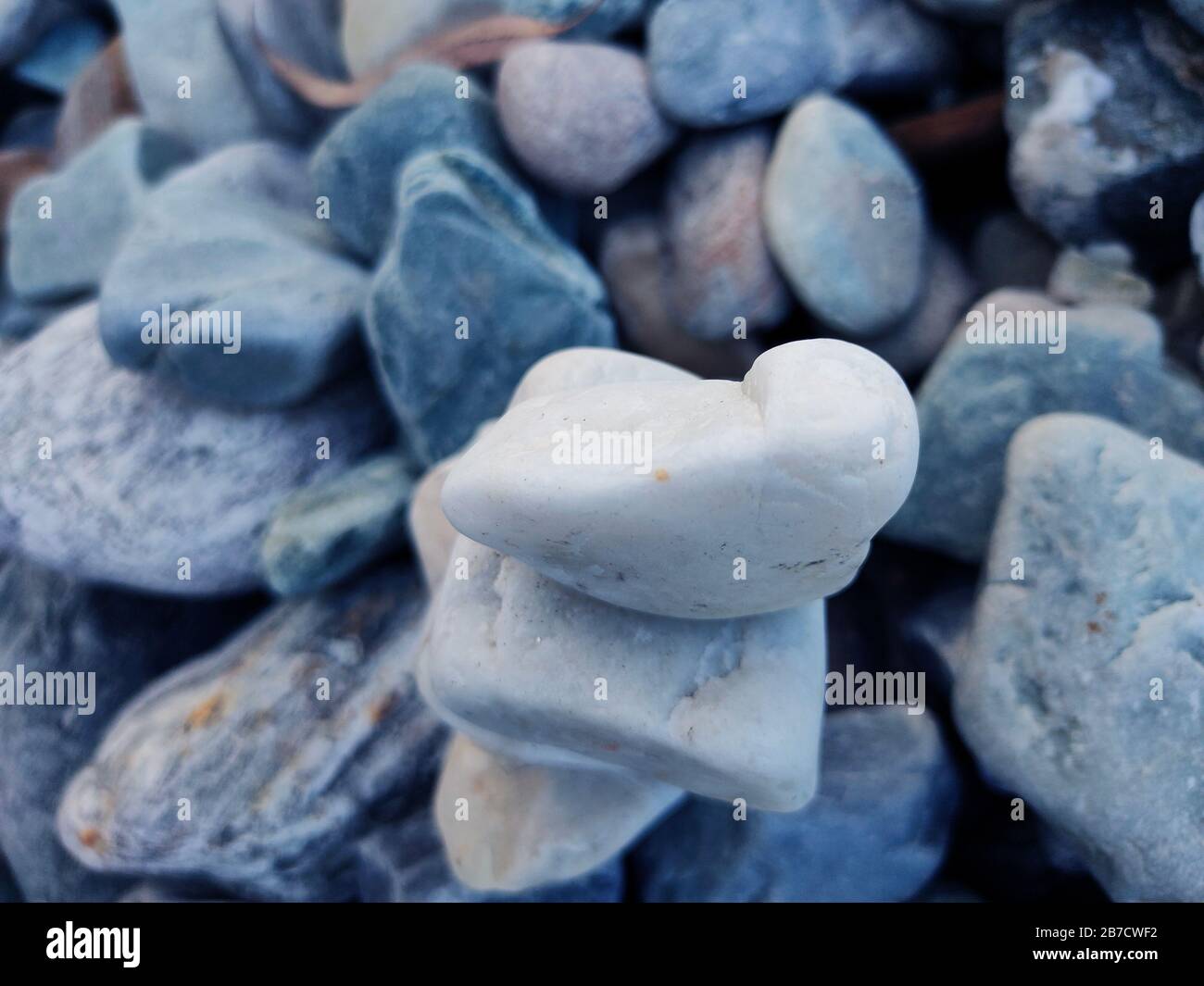 Stack of triangular stones.Group of white and colorful Stones.Pebble ...