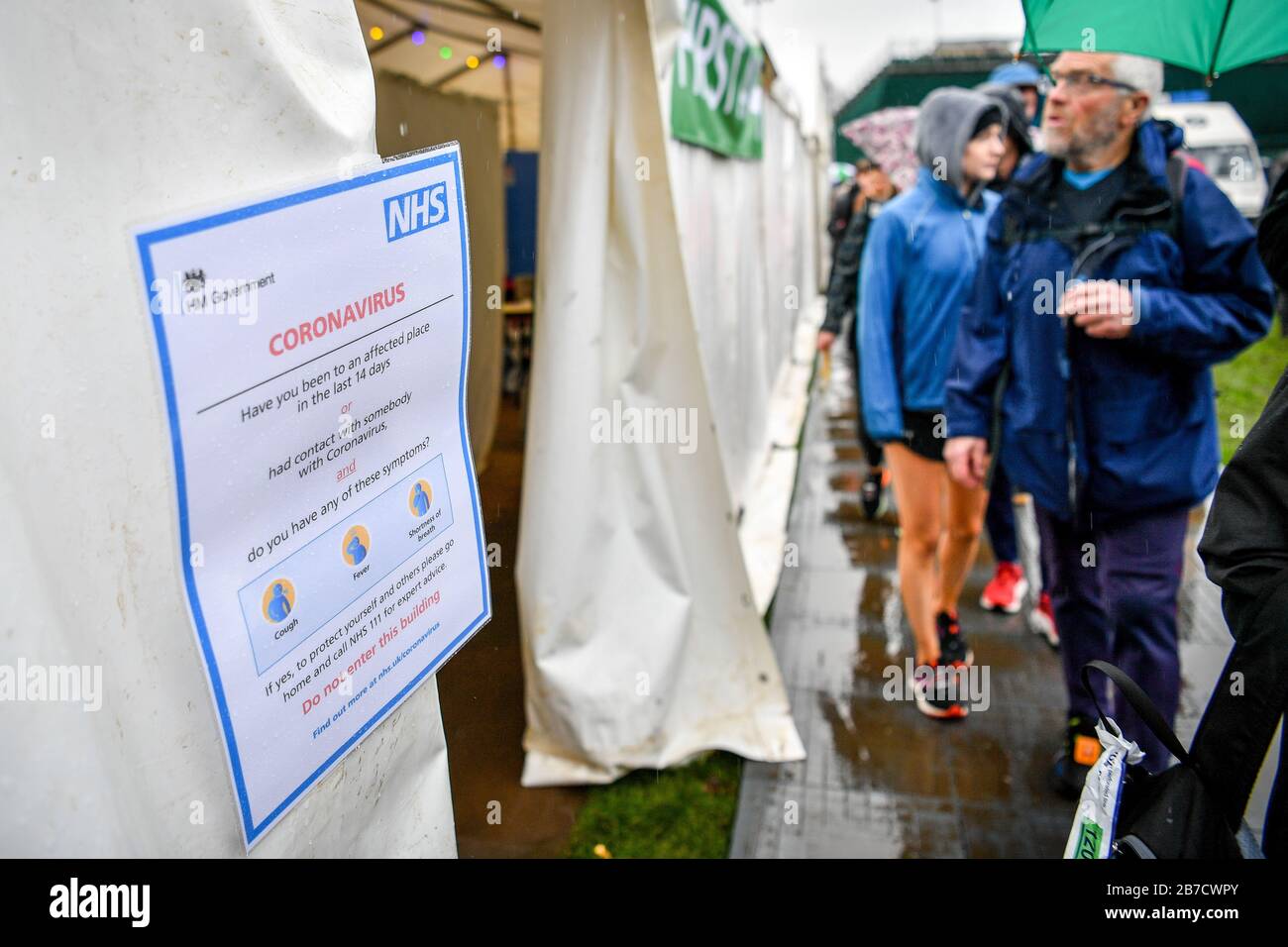 A notice outside the first aid tent in the runners village advises ...