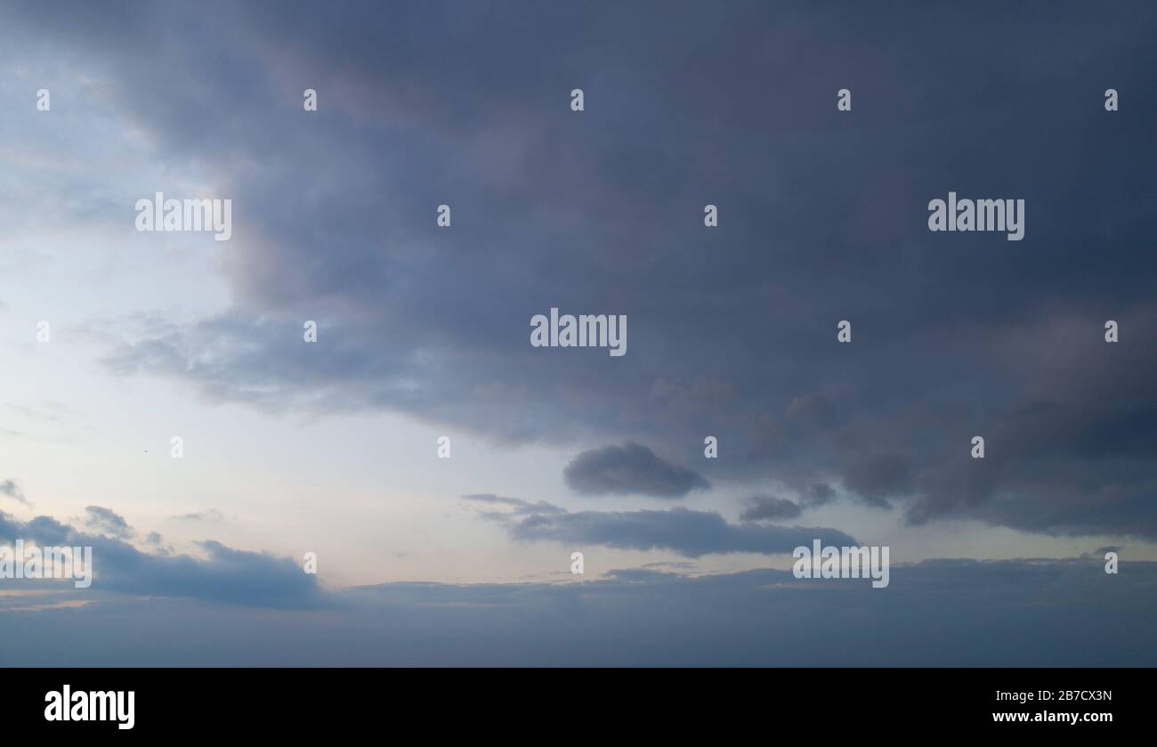 Beautiful sky with stretched clouds during twilight Stock Photo - Alamy