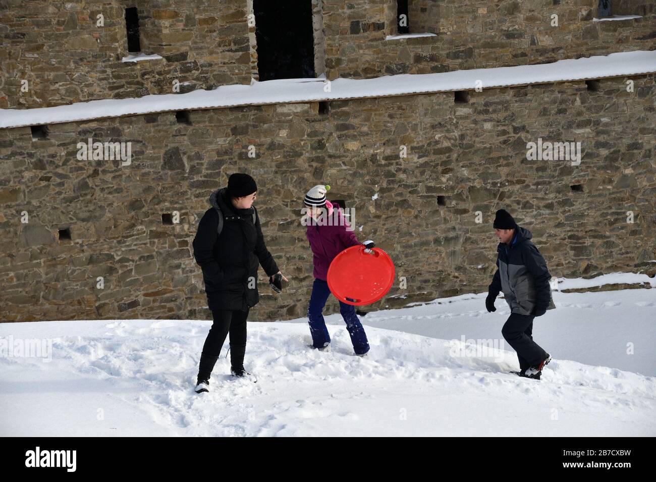 Family trip on castle ruins on the snow in winter Zborov Slovakia Stock ...