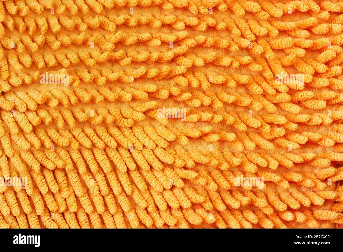 Texture of fabric with a large pile of orange color close-up Stock ...