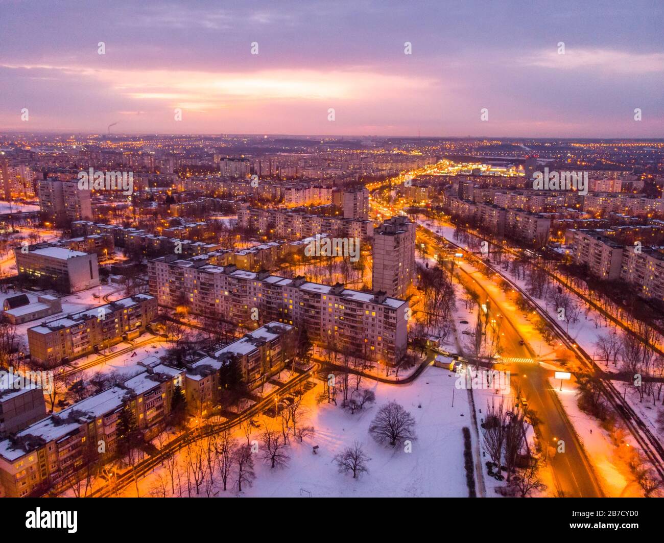 Aerial city winter view with crossroads and roads, houses, buildings ...