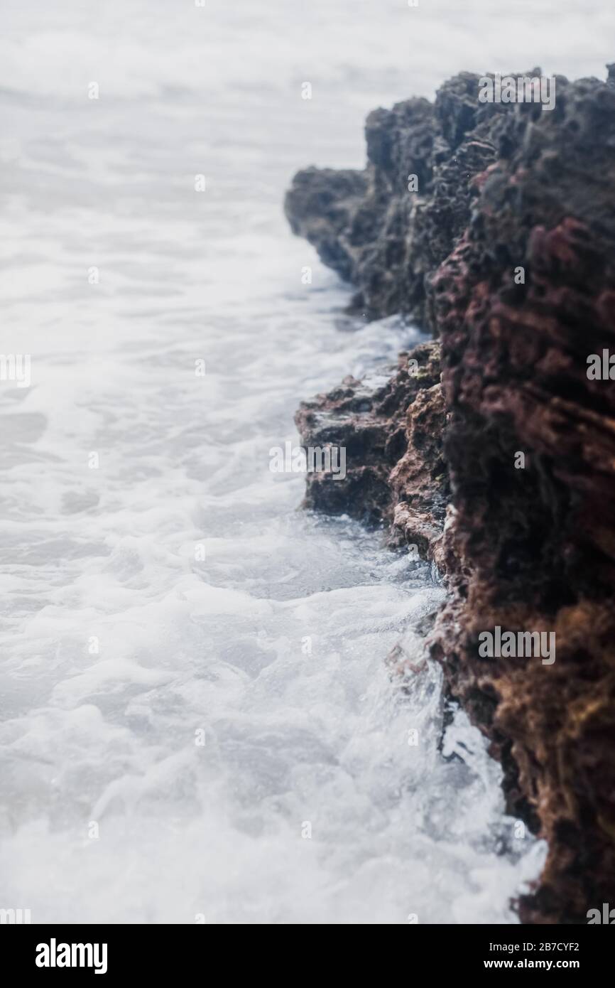 Storm in the ocean, sea waves crashing on rocks on the beach coast ...