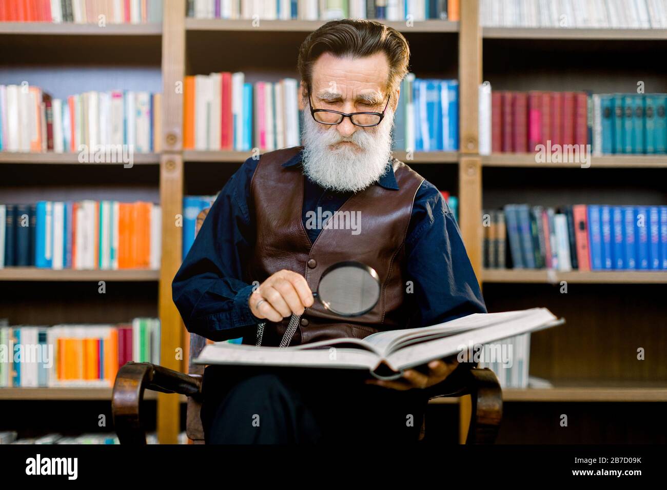 Mature teacher holding glasses hi-res stock photography and images - Alamy