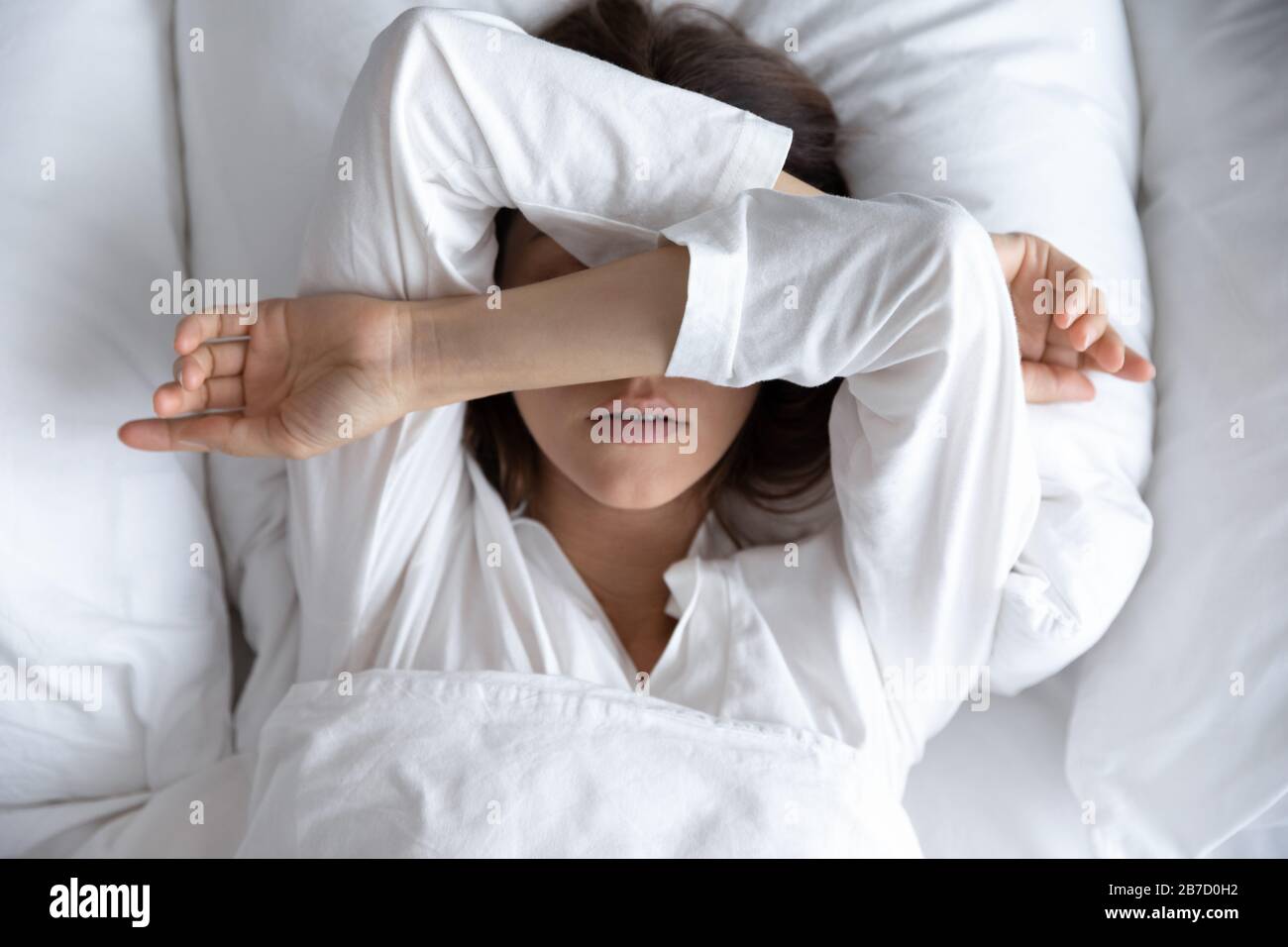 Stressed 30s lady feeling restless after sleepless night Stock Photo ...