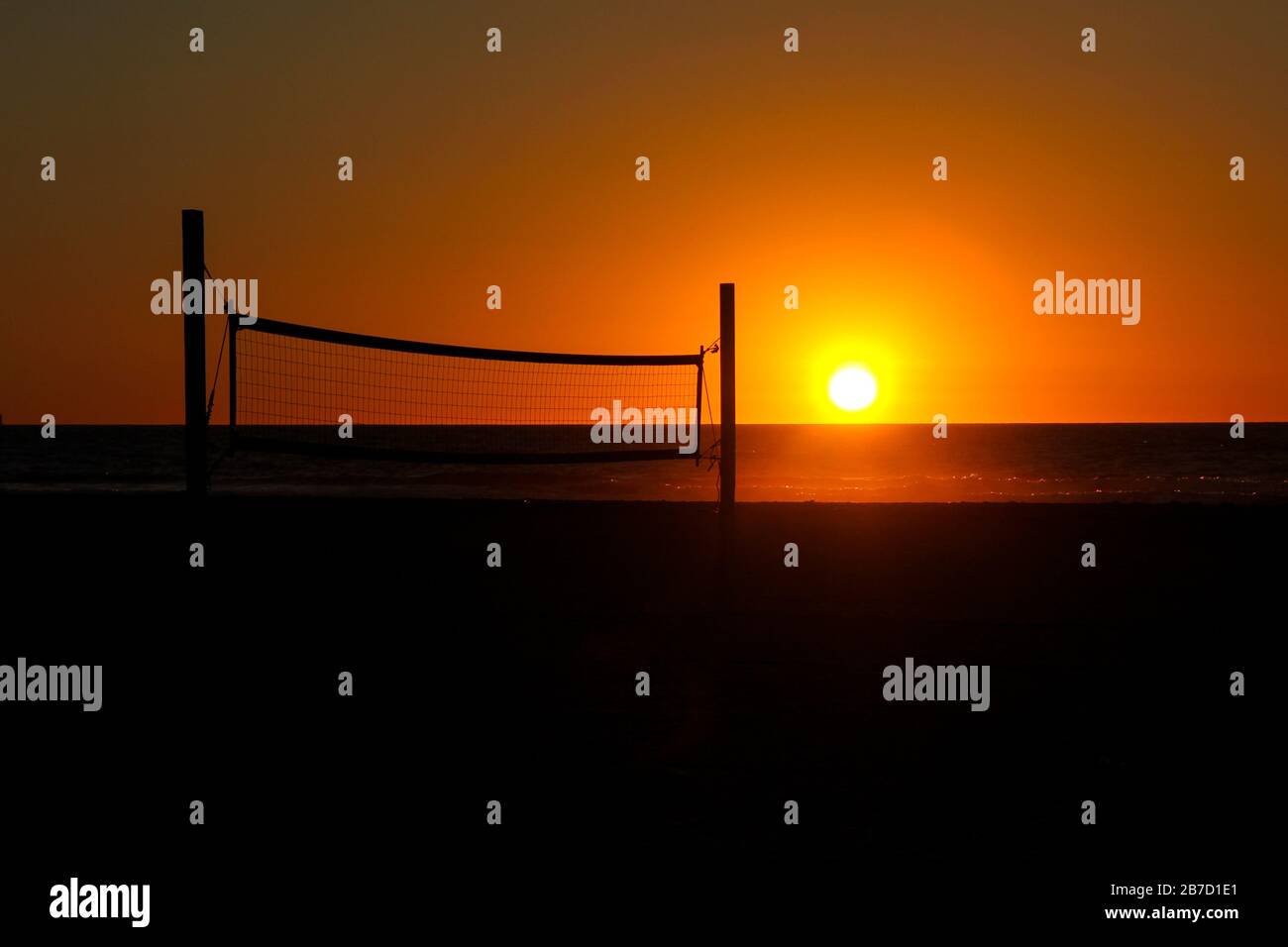 beachvolleyball court at the seaside during sunset Stock Photo - Alamy