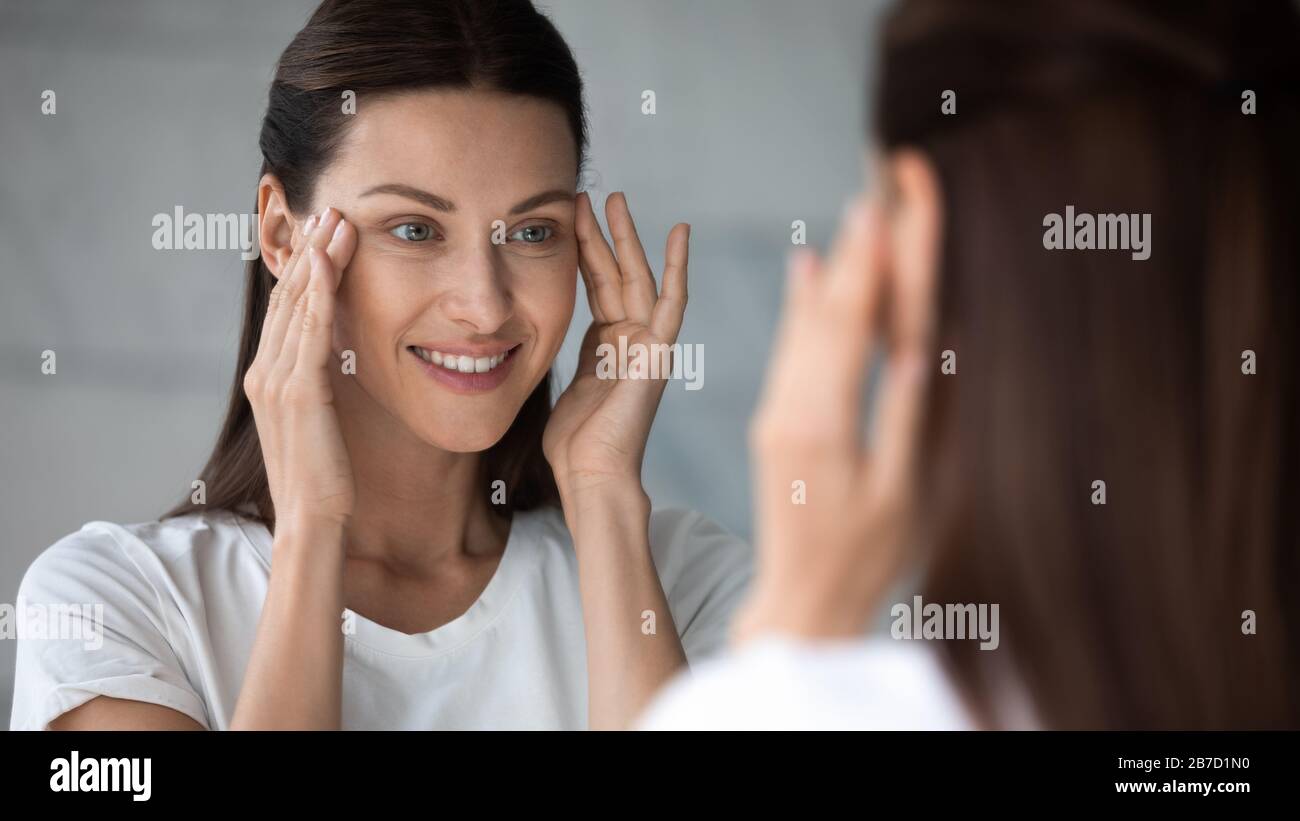 Happy client satisfied with eyes area condition after spa procedure ...