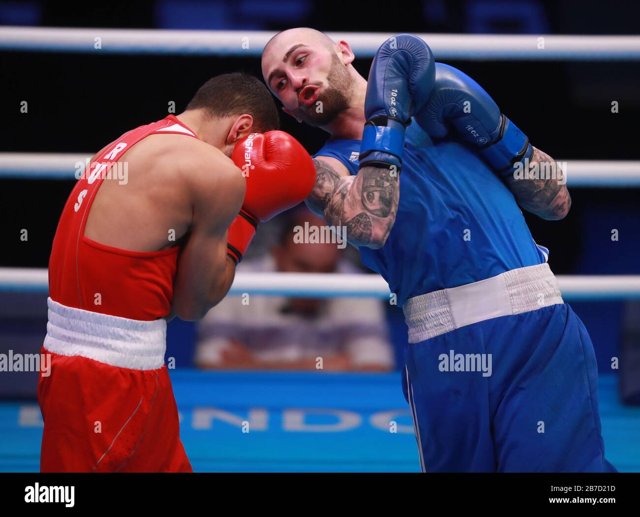 Georgia's Lasha Guruli (blue) in action against Russia's Gabil Mamedov ...