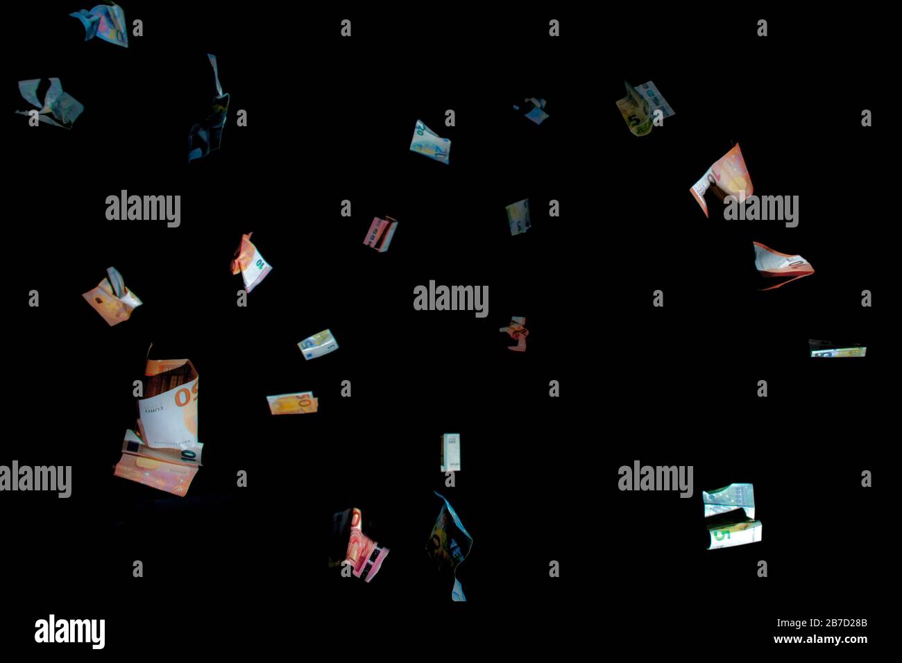 Falling money from the sky at night flying bills Stock Photo - Alamy