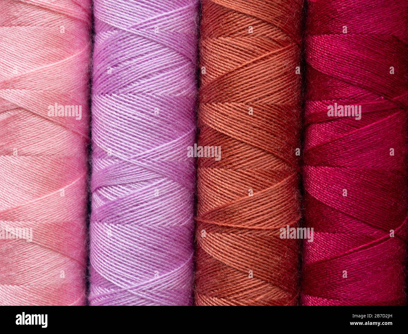 Set of multi-hue thread bobbins. An idea for a colorful background ...