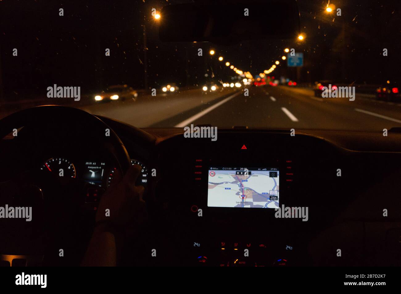 Driving car at night with navigator with rain Stock Photo - Alamy