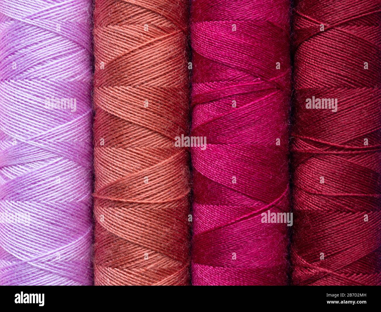 Set of multi-hue thread bobbins. An idea for a colorful background ...