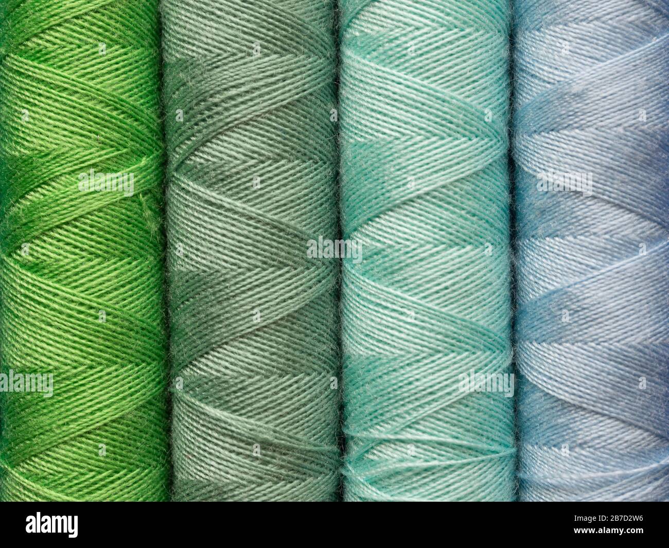 Set of multi-hue thread bobbins. An idea for a colorful background ...